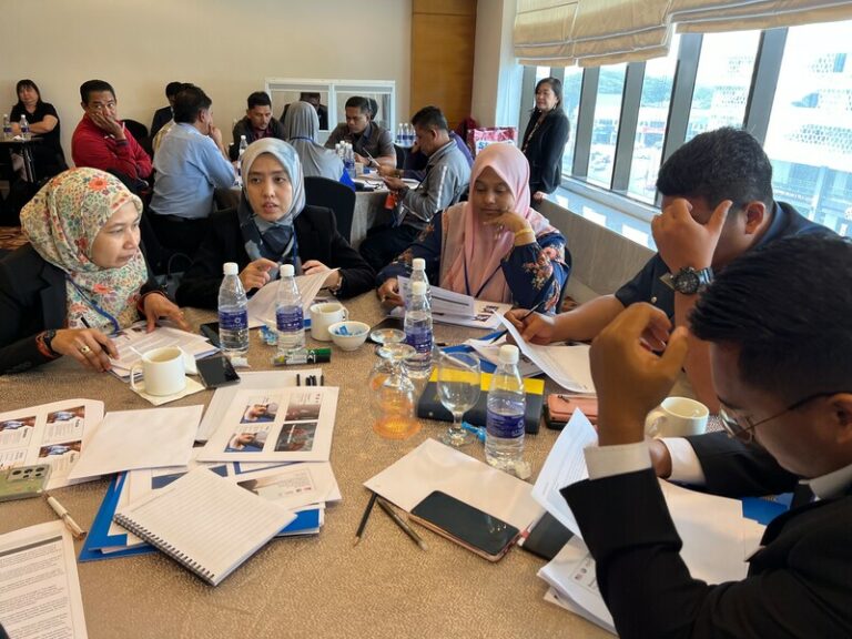 Participants taking part in a group activity at a session in Kelantan
